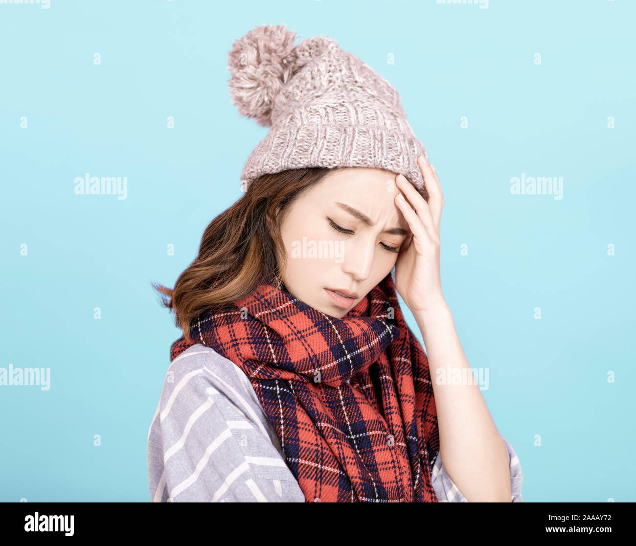 Young woman headache holding hi-res stock photography and images - Alamy