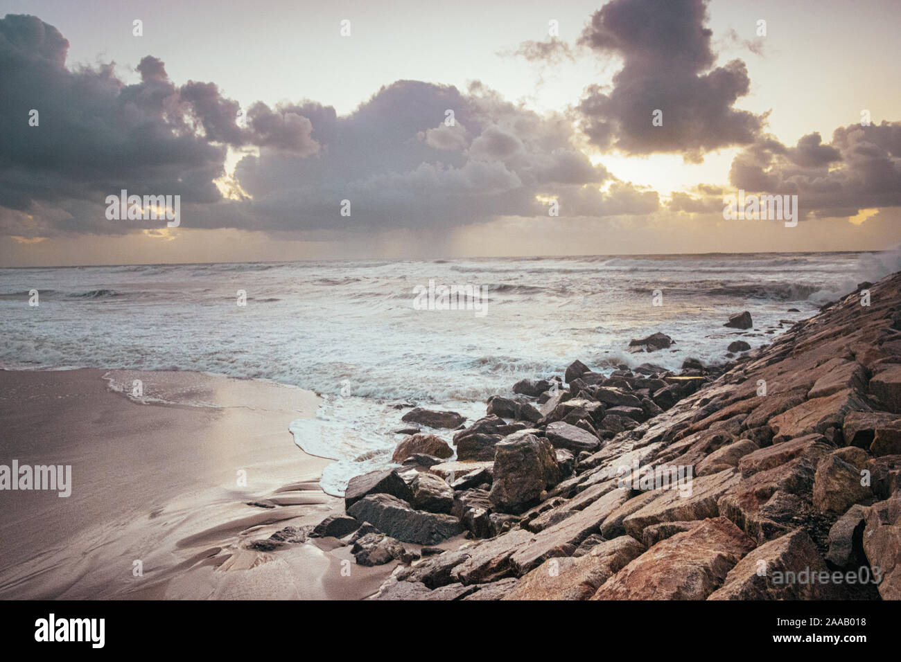 a sunset on a winter beach Stock Photo - Alamy