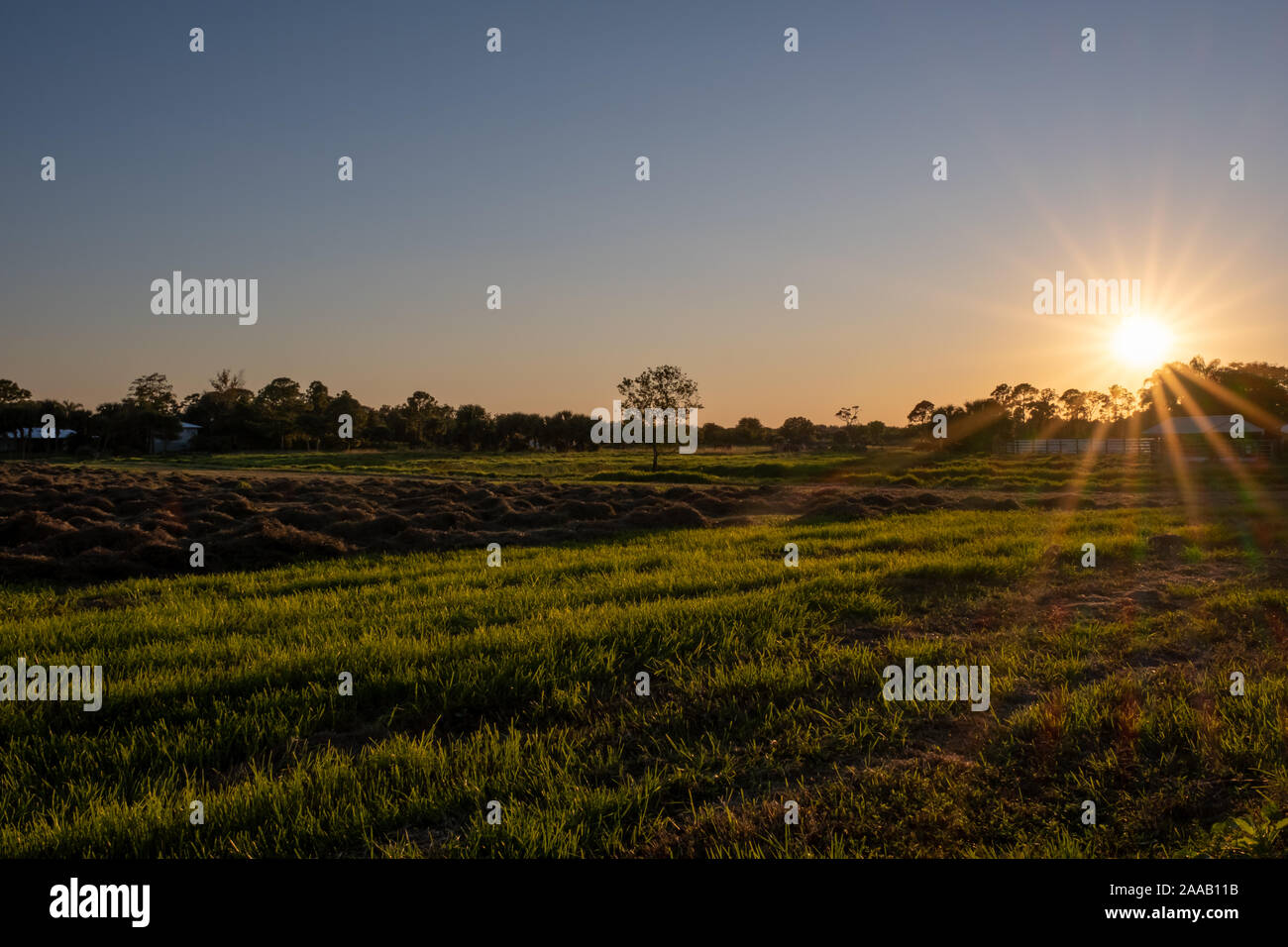 Sunset Over the Ranch Stock Photo - Alamy