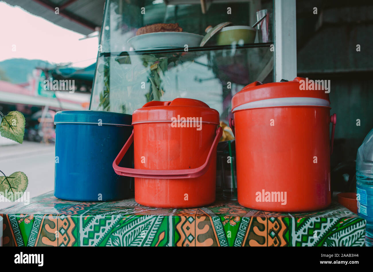 Plastic Ice Coolers with cold water and ice in Asian street restaurant ...
