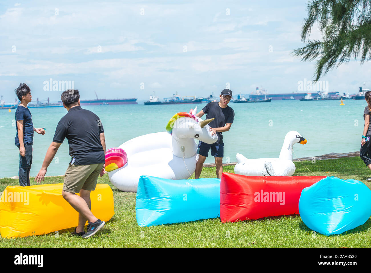 Team bonding exercise at the beach. Group of young teens having fun ...