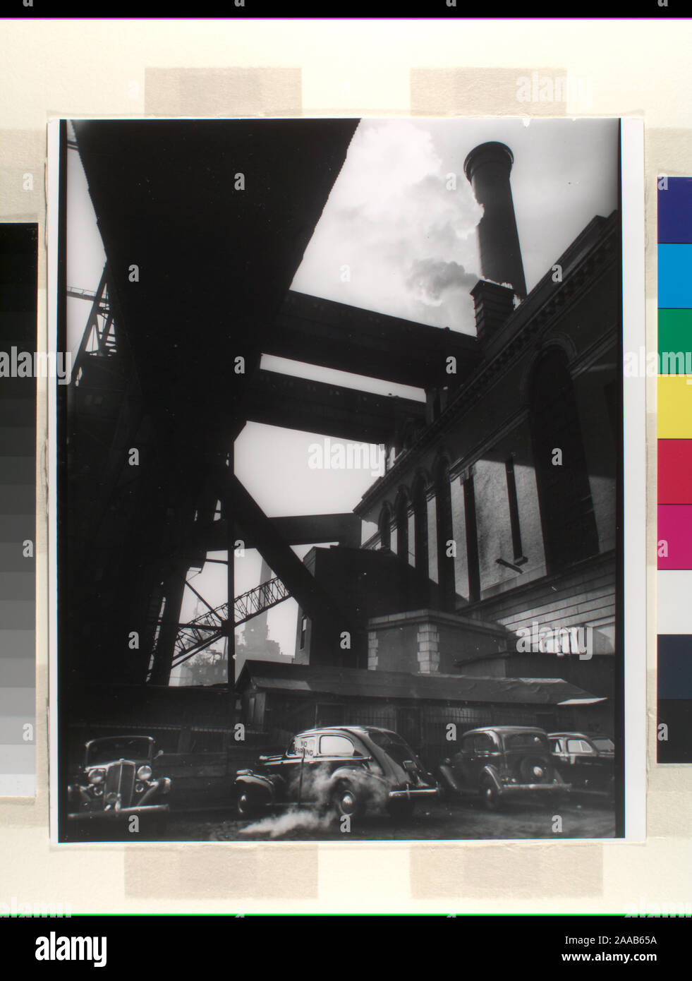 Bridges, conveyors(?), and chutes connect overhead to brick building ...