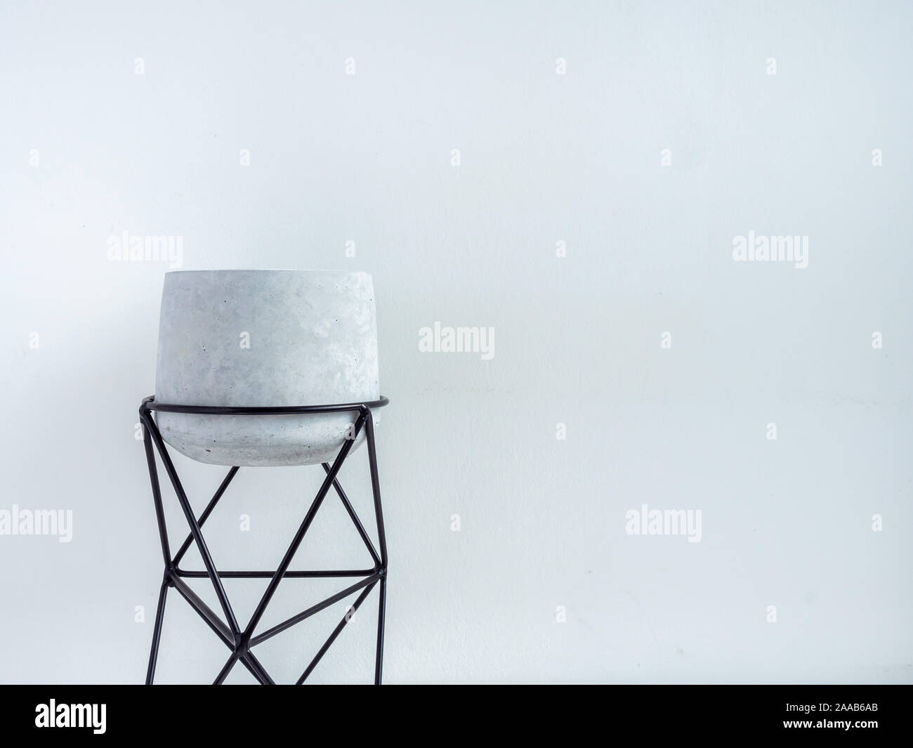 Cactus pot. Concrete pot with iron stand. Empty modern standing planter ...