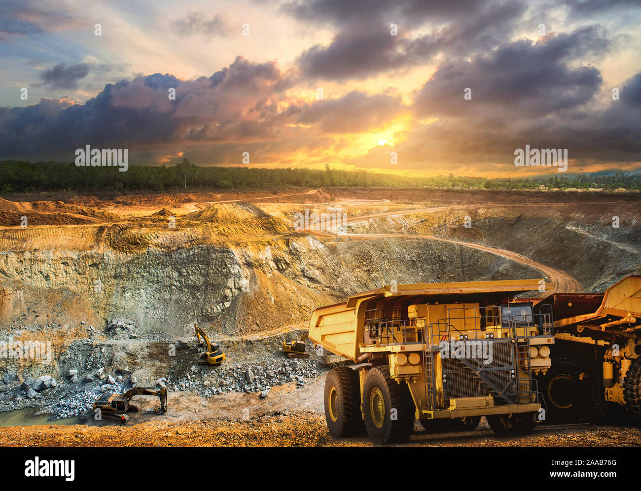 Yellow dump truck loading minerals copper, silver, gold, and other at ...