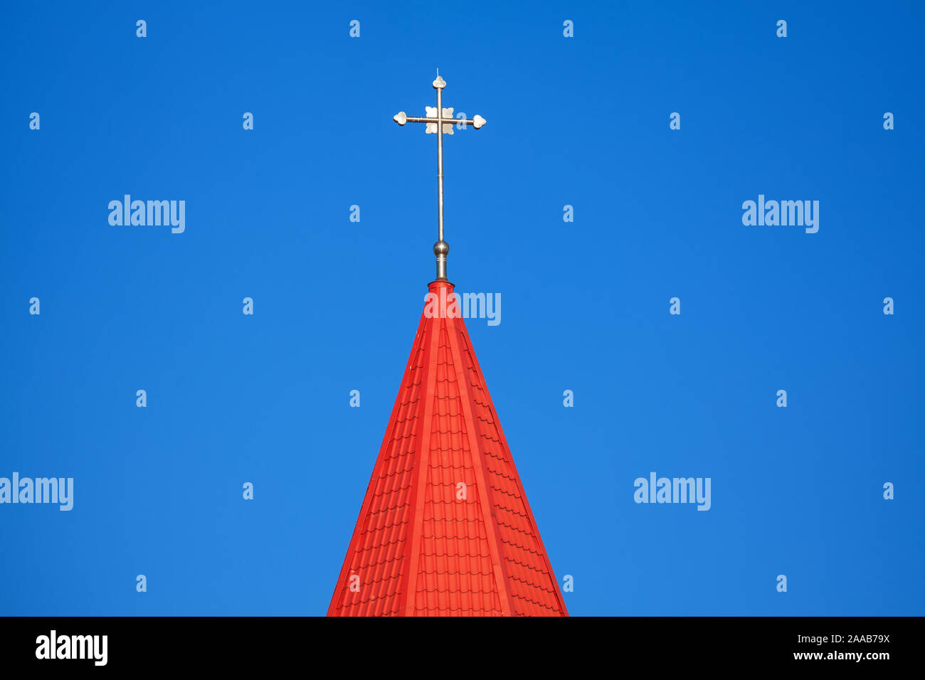 red spire with cross on the top Stock Photo - Alamy