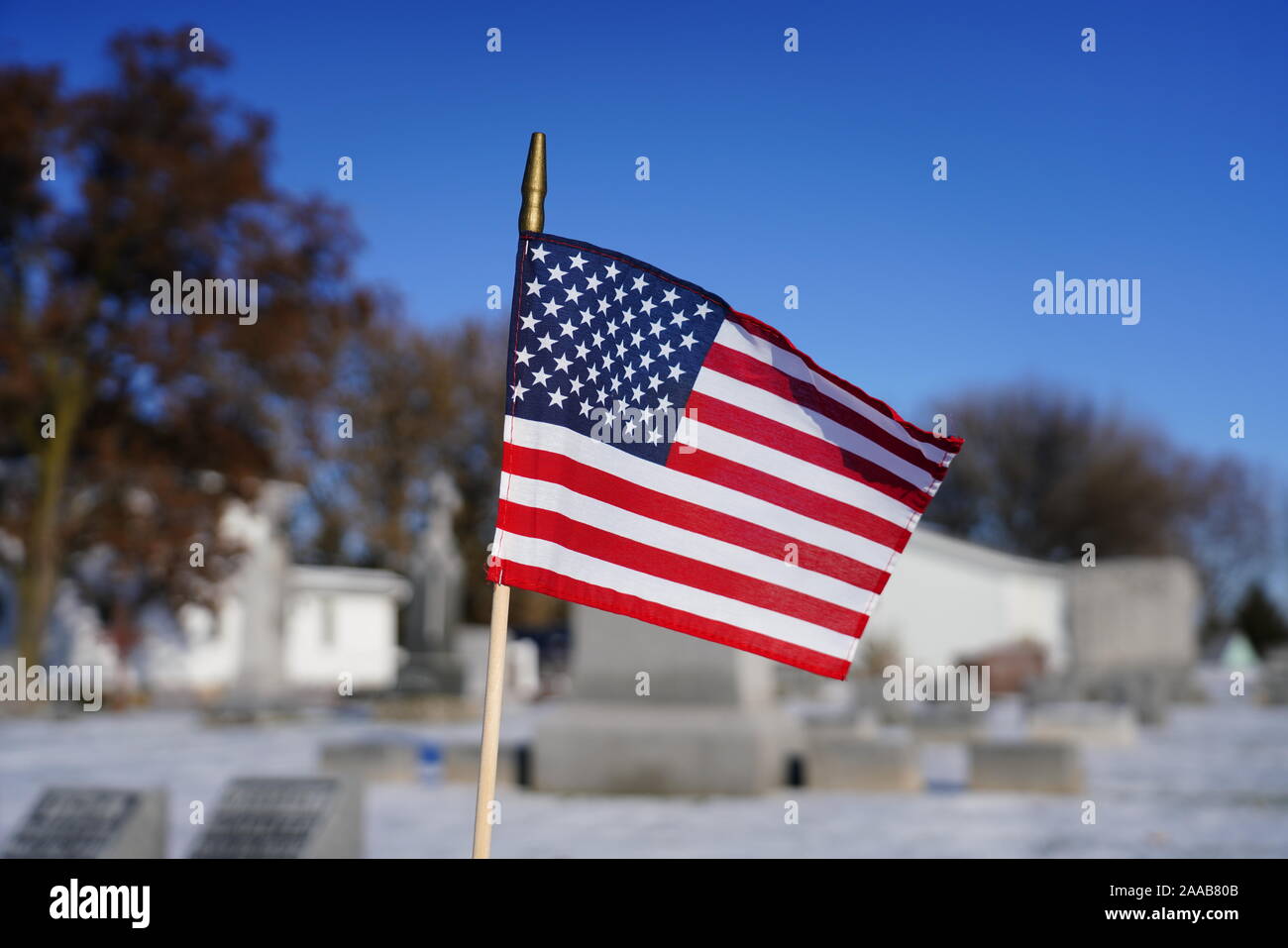 The American flag stands in the cold windy weather Stock Photo - Alamy