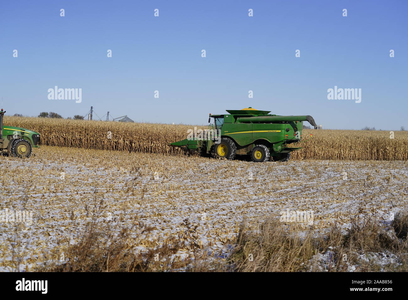 John Deere Combine being used to farm and gather animal feed stocks ...