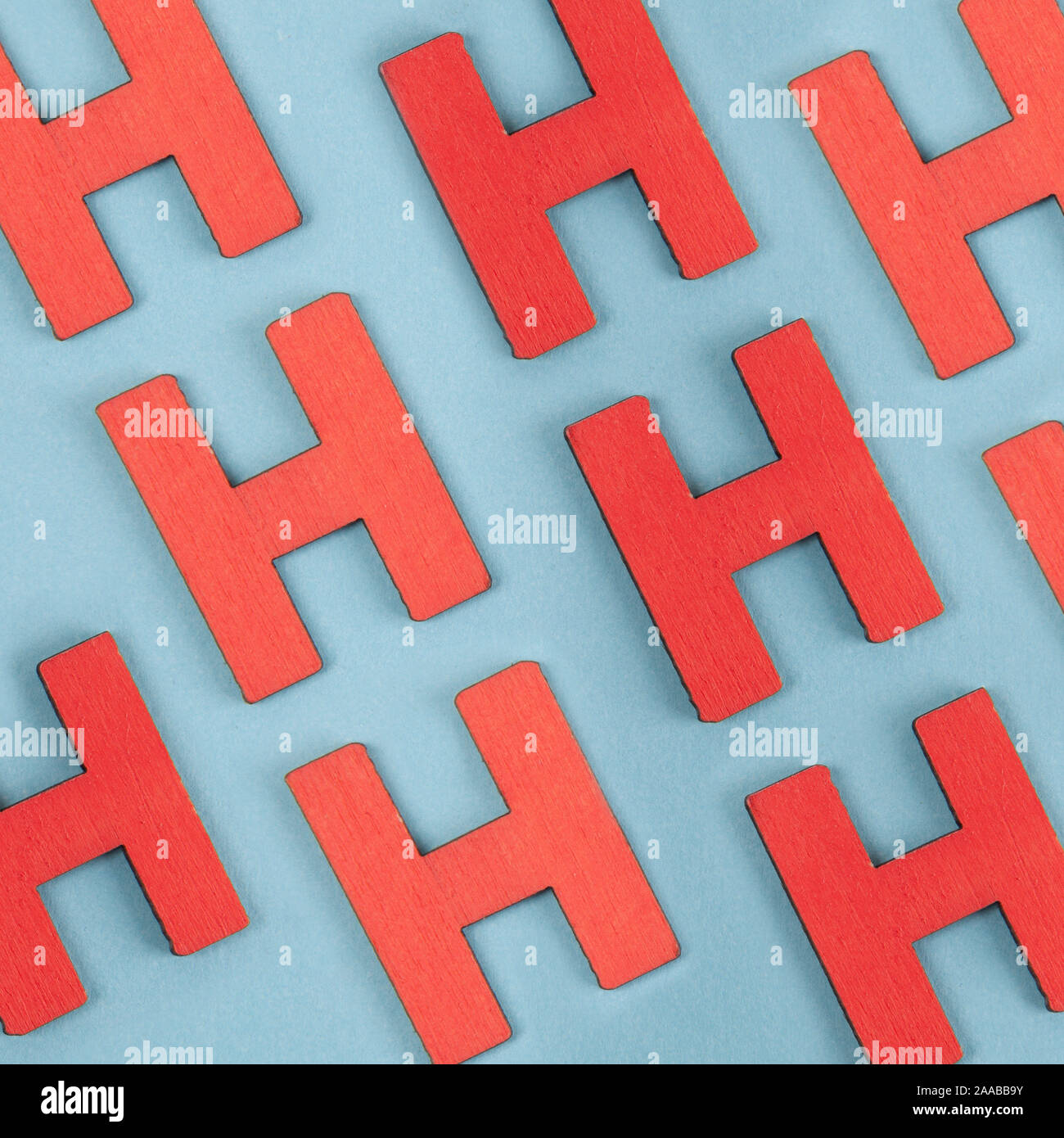 Seamless pattern of red capital letters H on blue background Stock ...