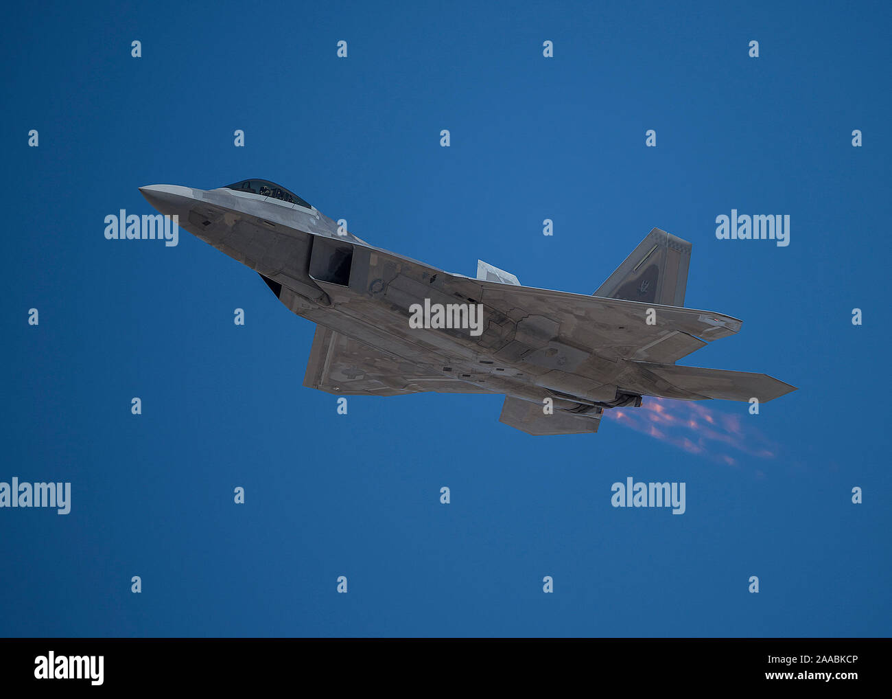 An F-22 Raptor fighter jet assigned to the 433rd Weapons Squadron pops ...