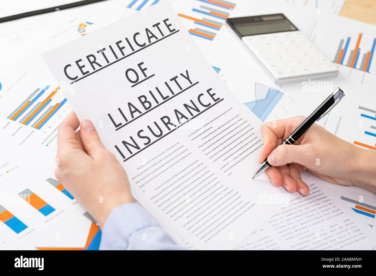 certificate of liability insurance concept, documents on the desktop ...