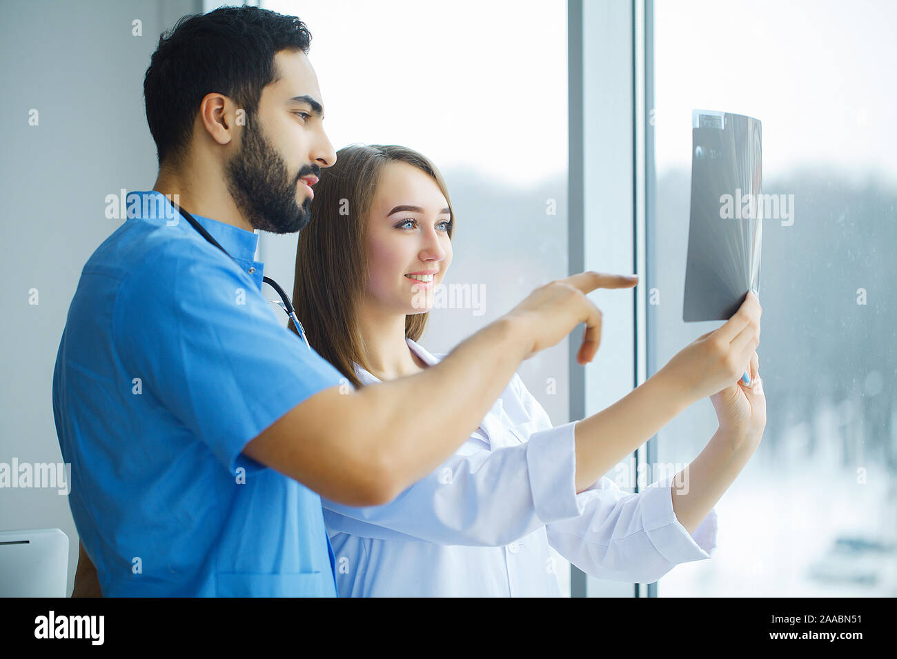 Group of medical workers working together in hospital Stock Photo - Alamy