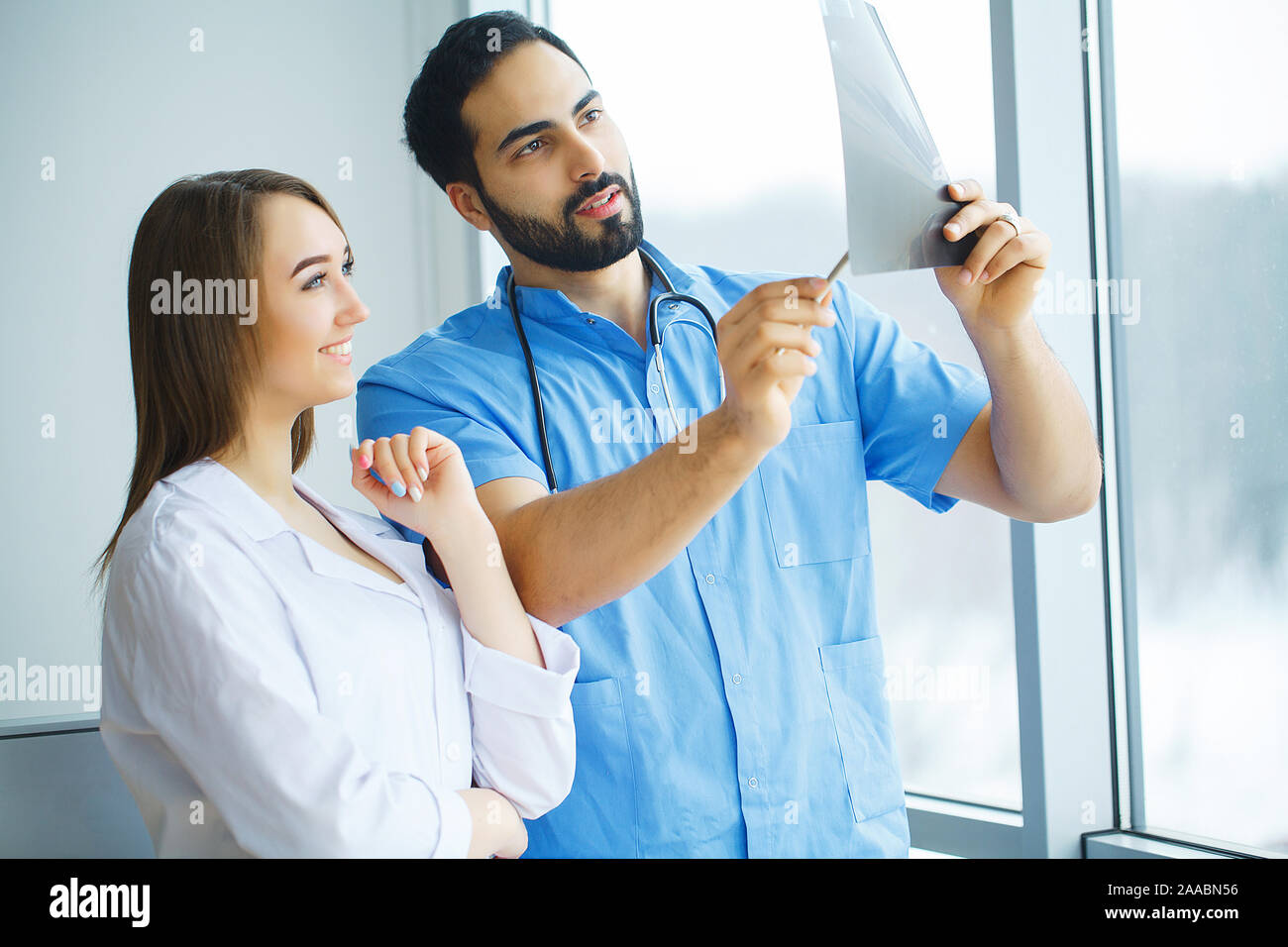 Group of medical workers working together in hospital Stock Photo - Alamy
