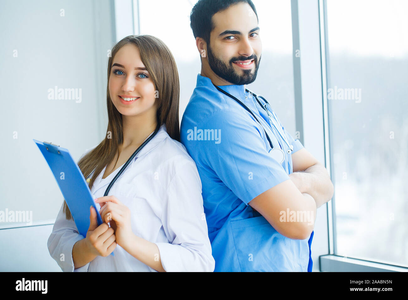Group of medical workers working together in hospital Stock Photo - Alamy