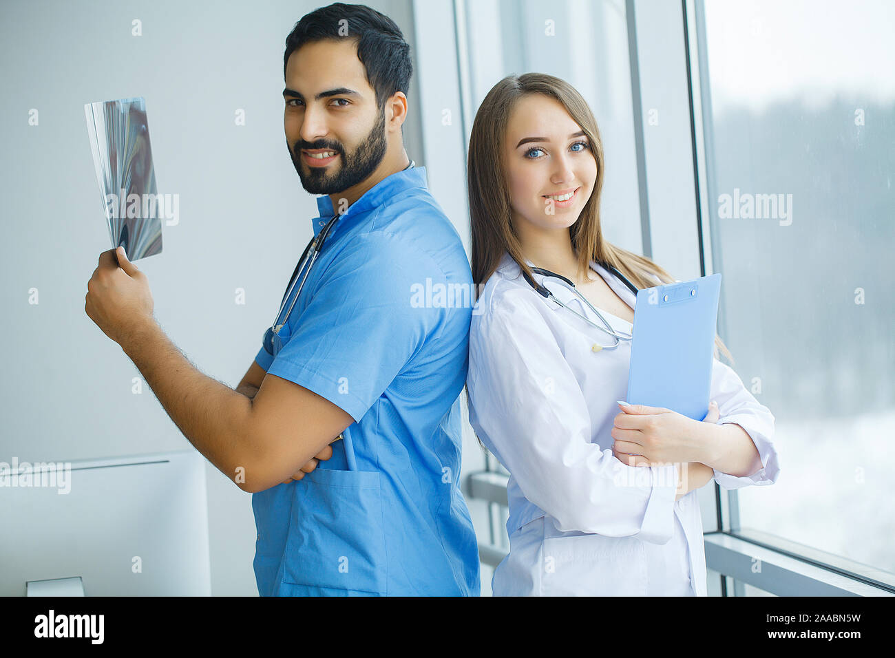 Group of medical workers working together in hospital Stock Photo - Alamy