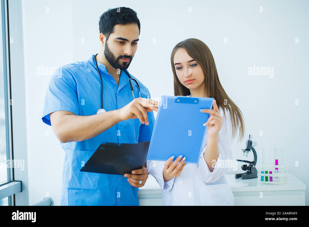 Group of medical workers working together in hospital Stock Photo - Alamy