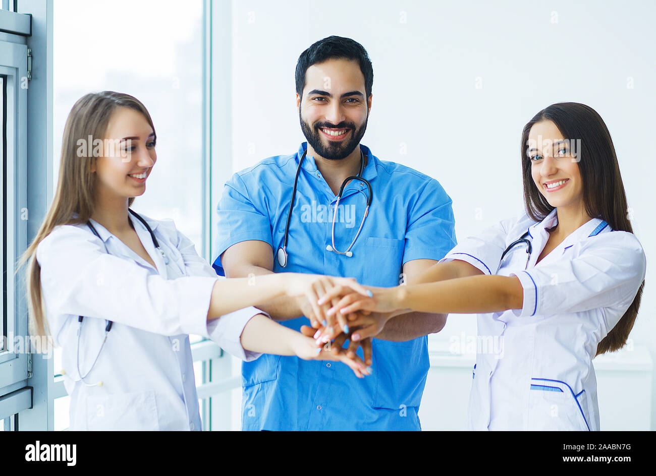 Group of medical workers working together in hospital Stock Photo - Alamy