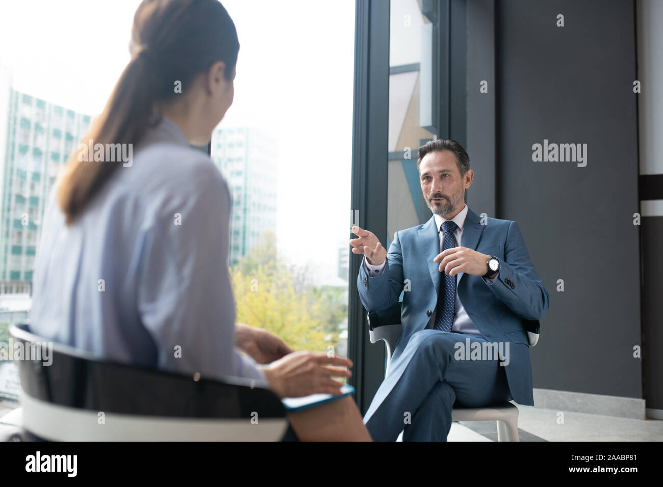 Businessman wearing elegant suit speaking with famous journalist Stock ...