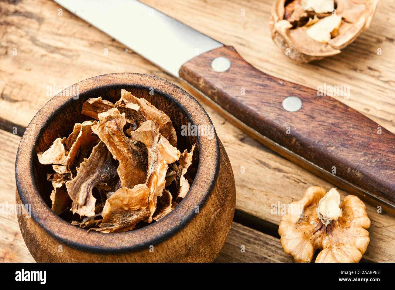 Healing properties of walnuts.Walnut membrane on wooden table.Walnut ...