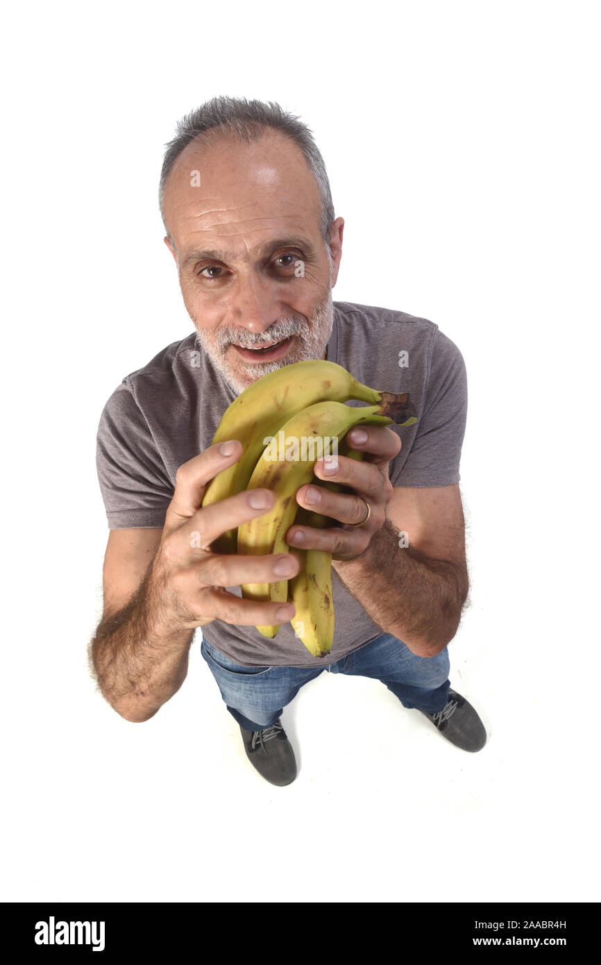 Old man eating banana Cut Out Stock Images & Pictures - Alamy