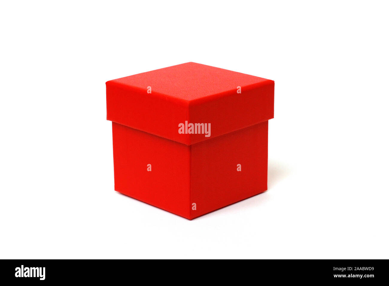 Red gift box with a lid on a white background. There is a place for ...