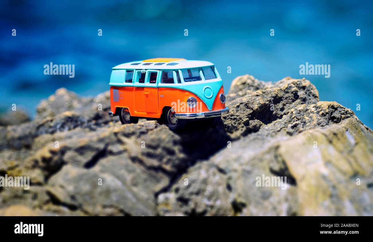 Vintage miniature orange and blue van. Travel concept Stock Photo - Alamy