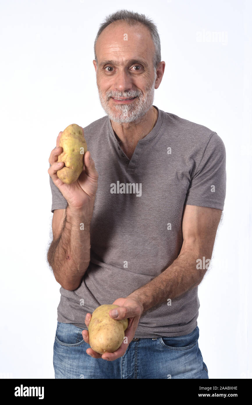 portrait of a man with potatoes on white background Stock Photo - Alamy