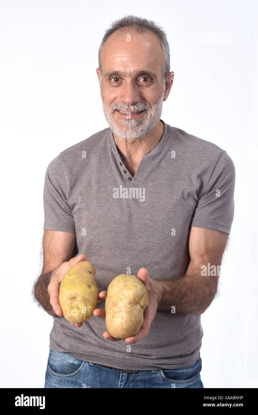 portrait of a man with potatoes on white background Stock Photo - Alamy