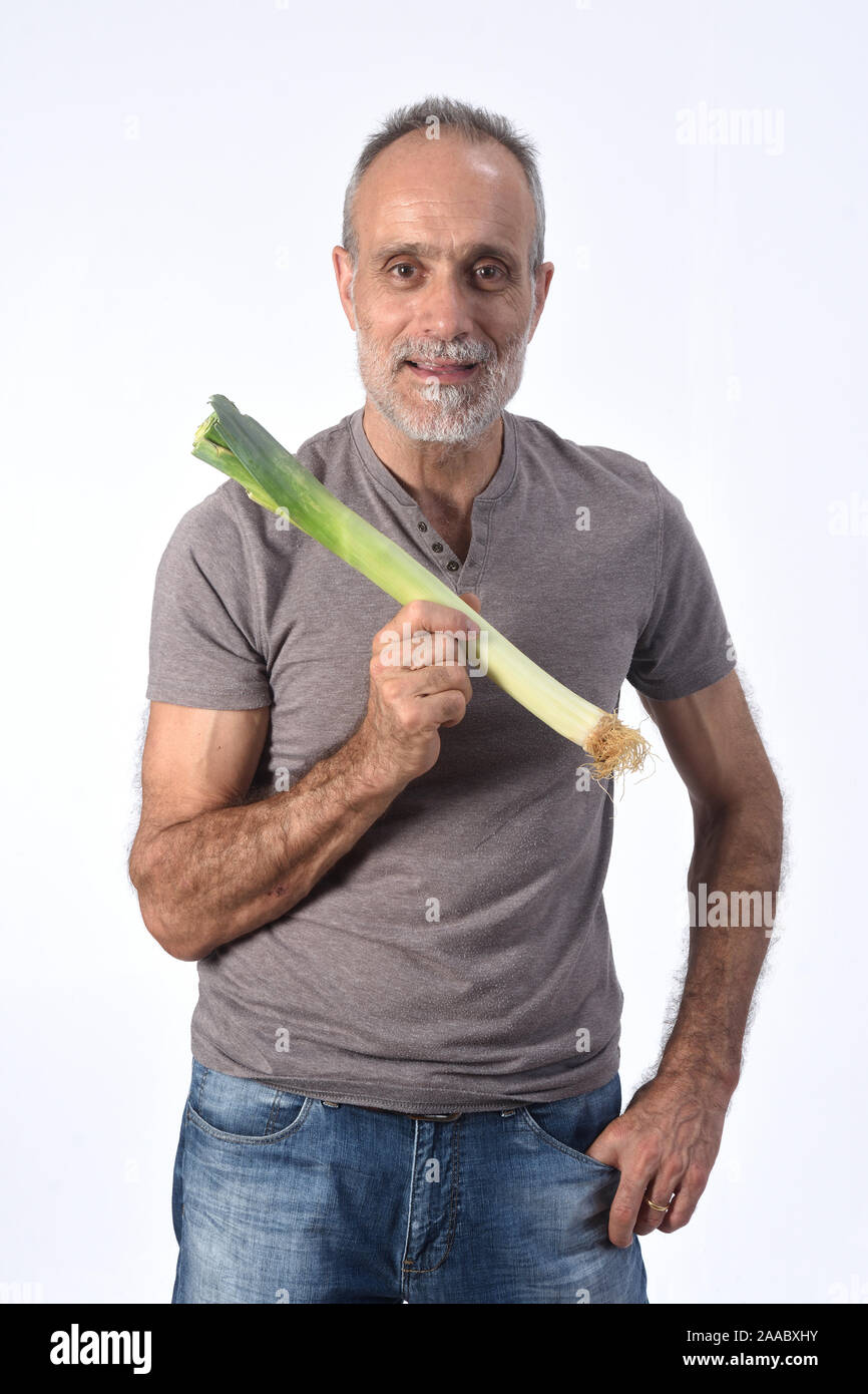 portrait of a man with leek on white background Stock Photo - Alamy