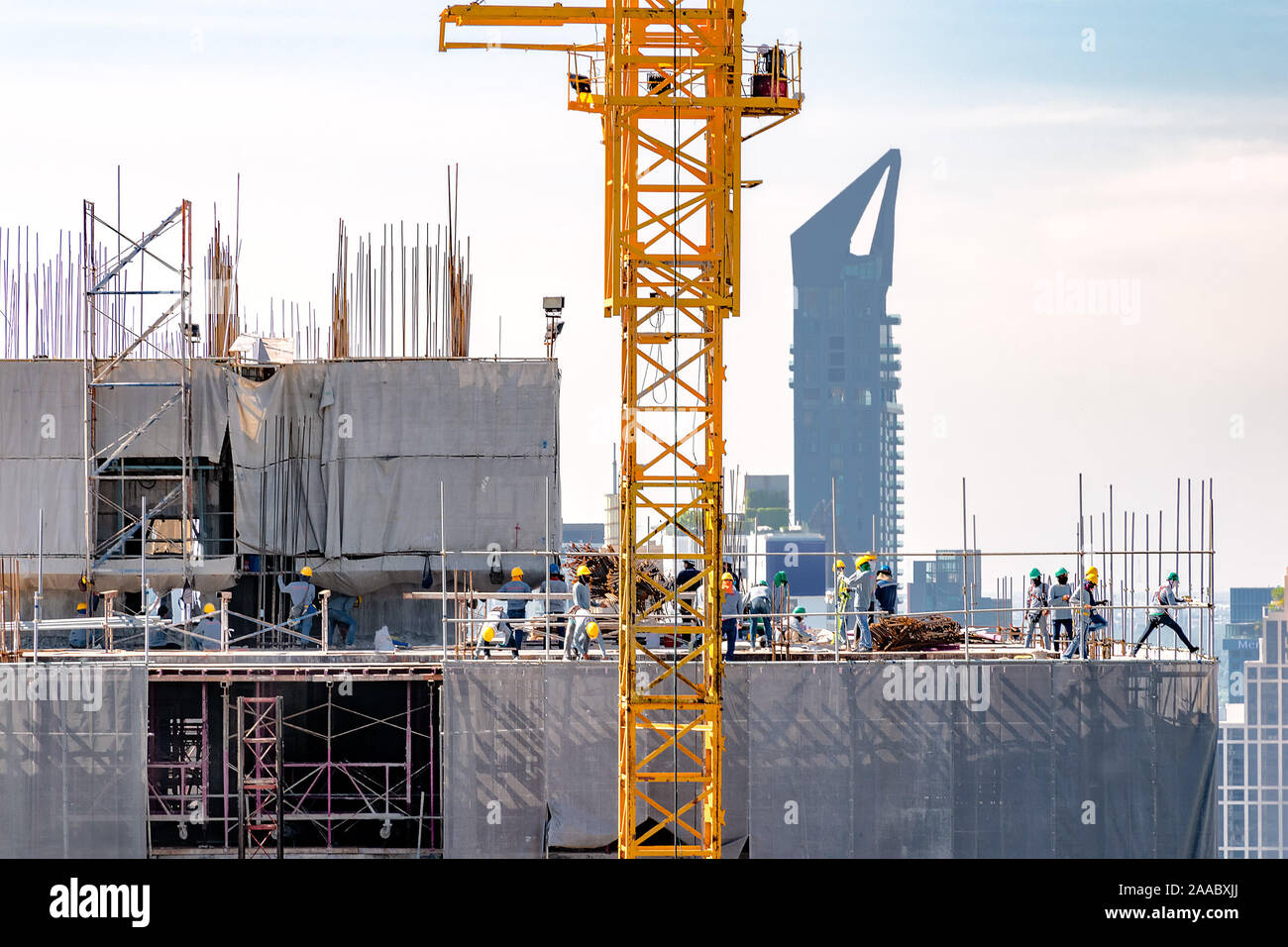 Aerial view of a building construction with tower crane, scaffolding ...