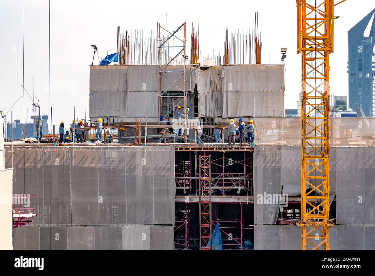 Aerial view of a building construction with tower crane, scaffolding ...