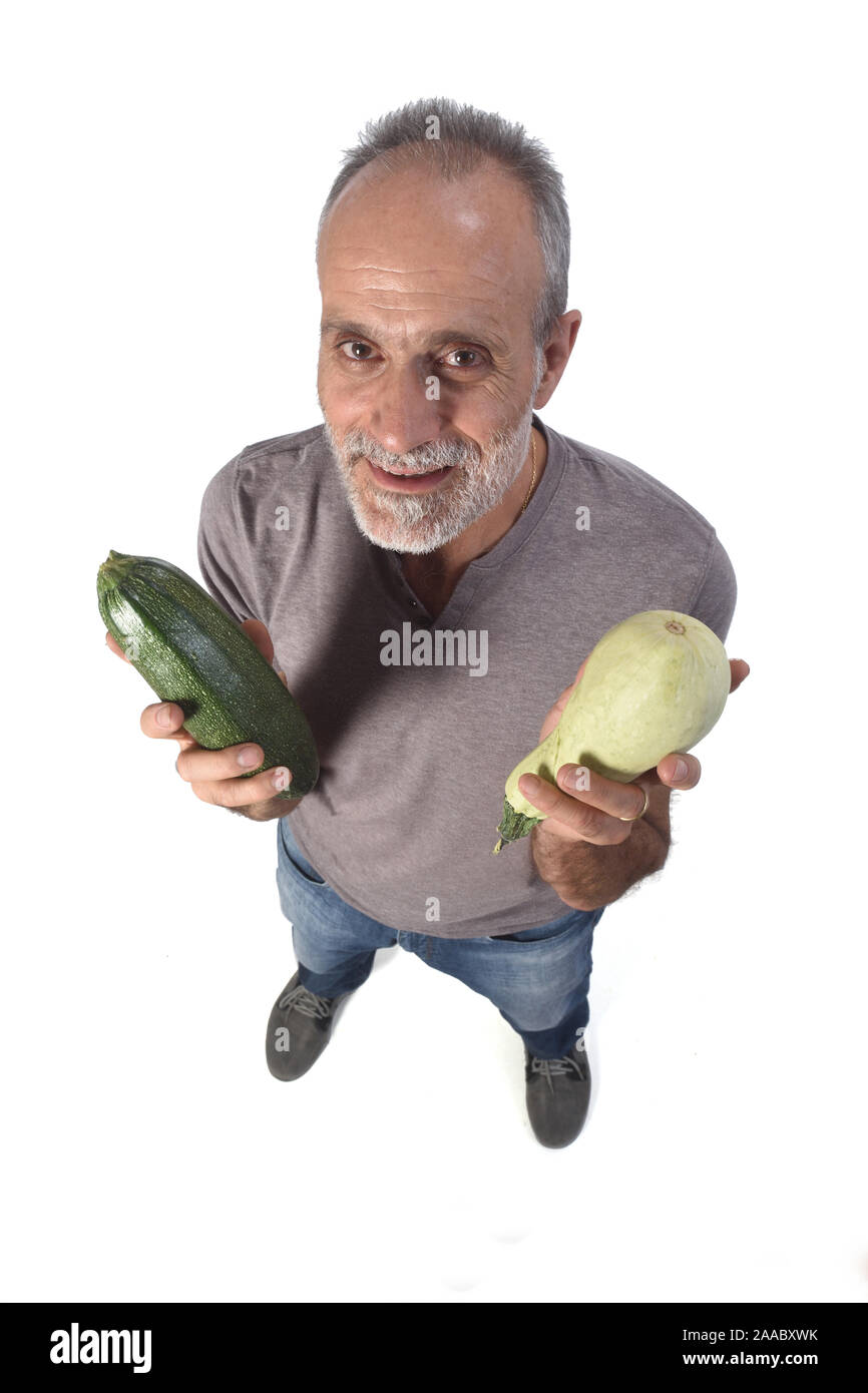 portrait of a man with zucchini on white background Stock Photo - Alamy