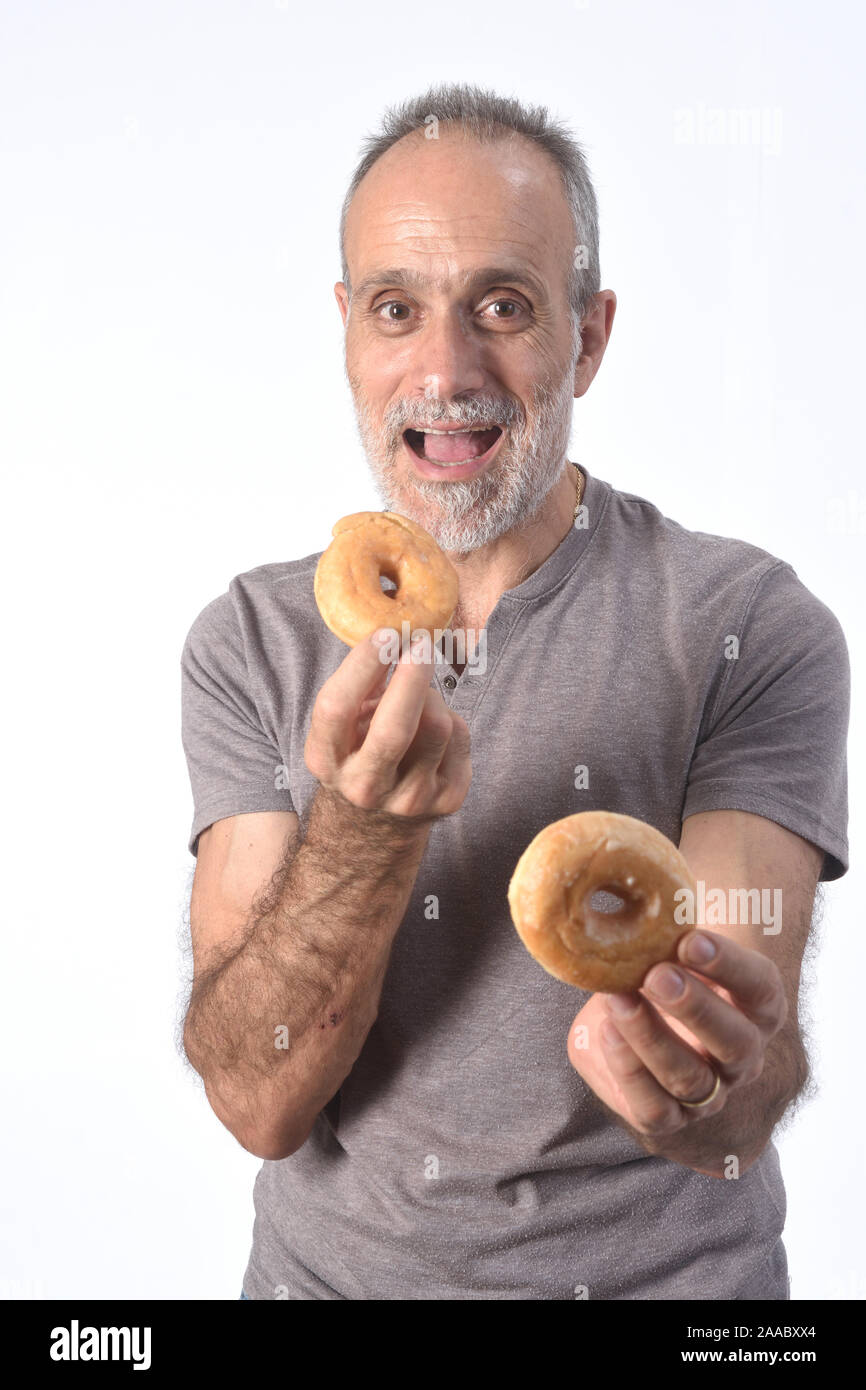 man with donuts on white background Stock Photo - Alamy