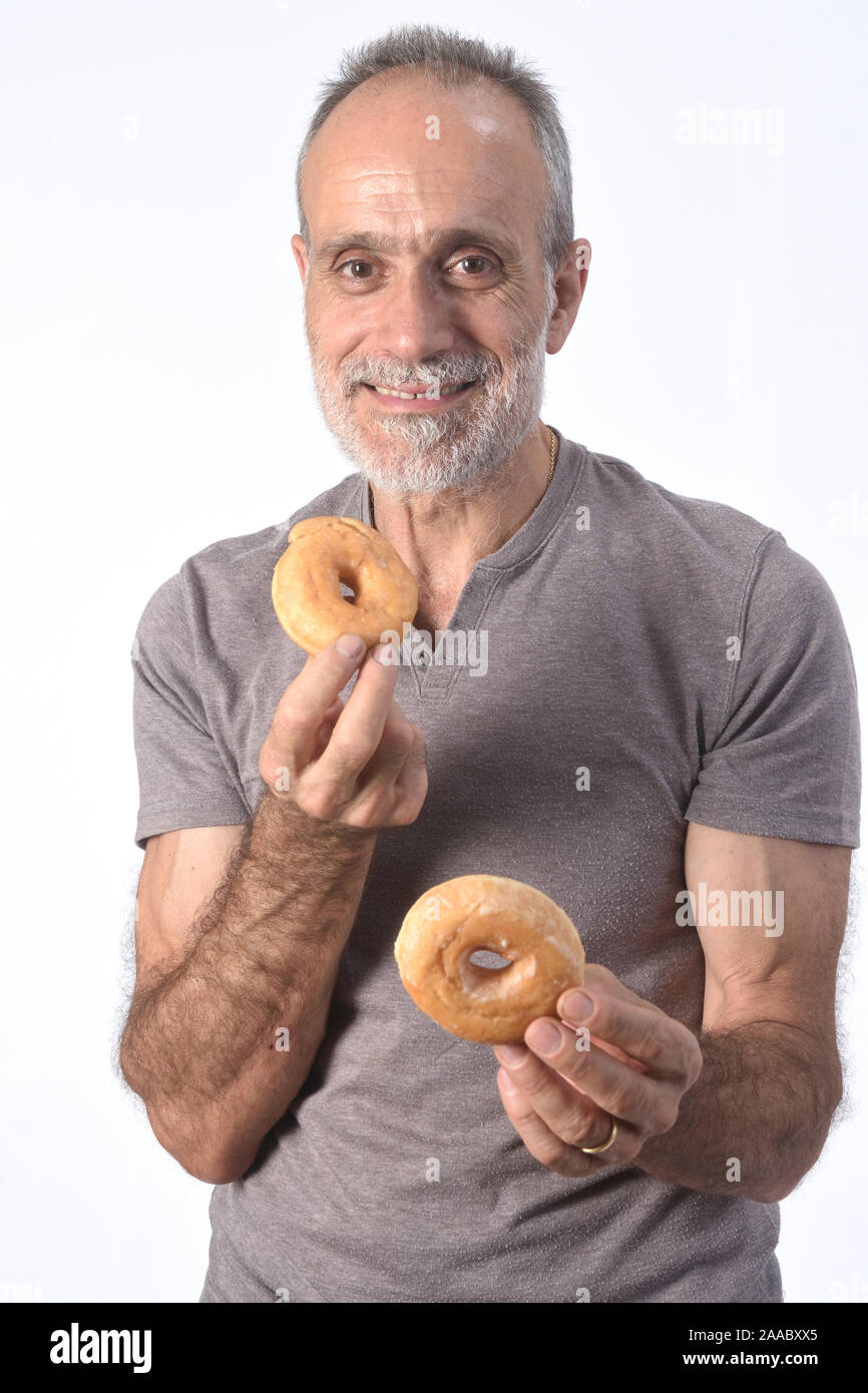 man with donuts on white background Stock Photo - Alamy
