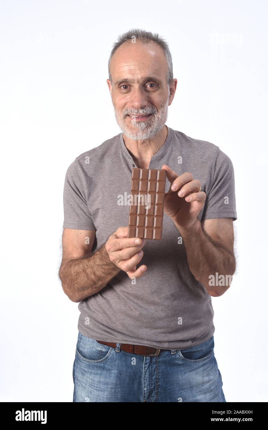 Old senior man eating chocolate hi-res stock photography and images - Alamy