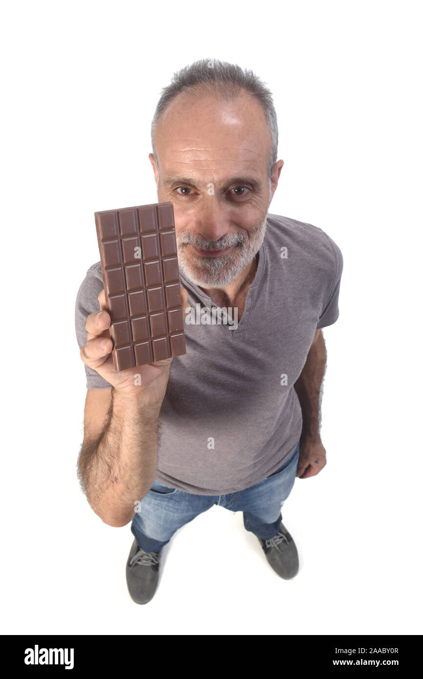 Old senior man eating chocolate hi-res stock photography and images - Alamy