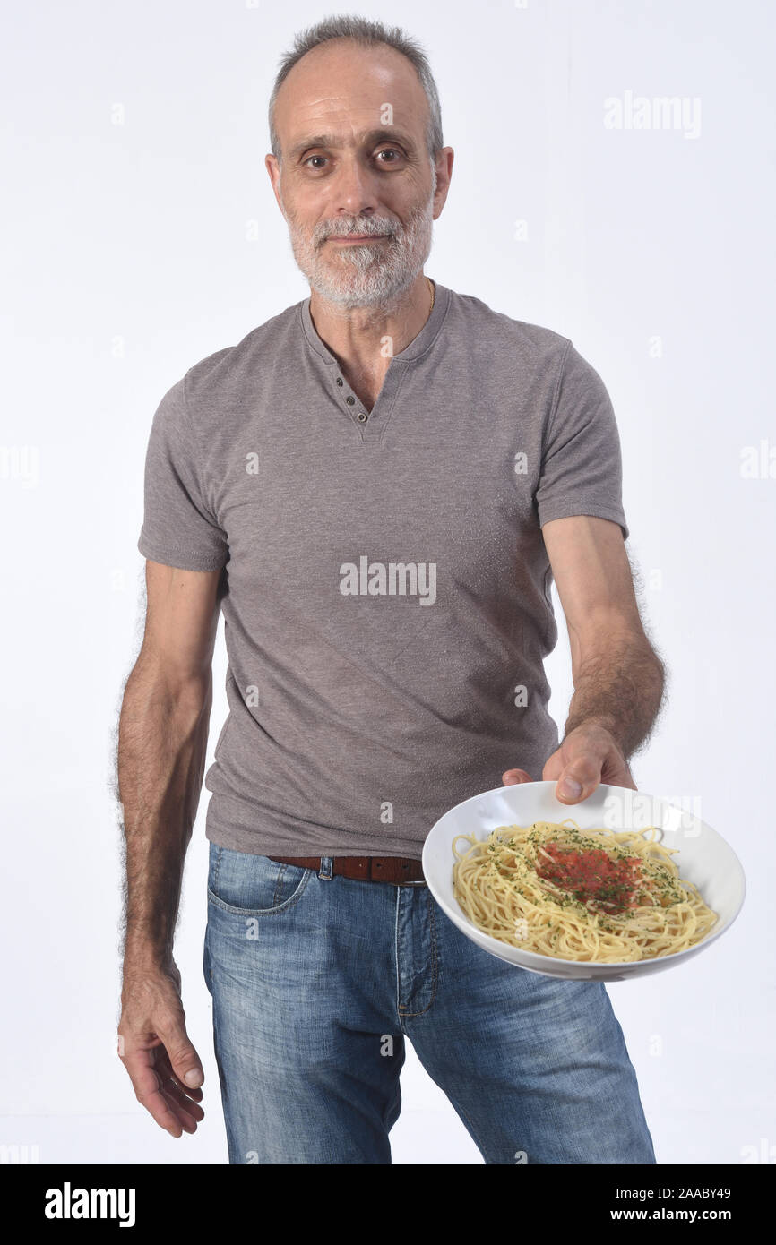 Old man eating pasta smile hi-res stock photography and images - Alamy