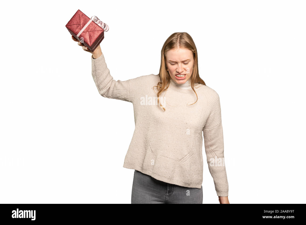 An angry young woman wants to smash her gift Stock Photo - Alamy