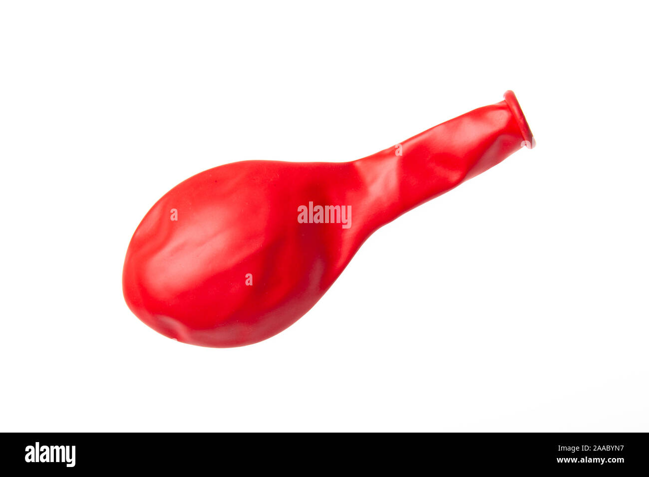 Red deflated balloon isolated on a white background Stock Photo - Alamy