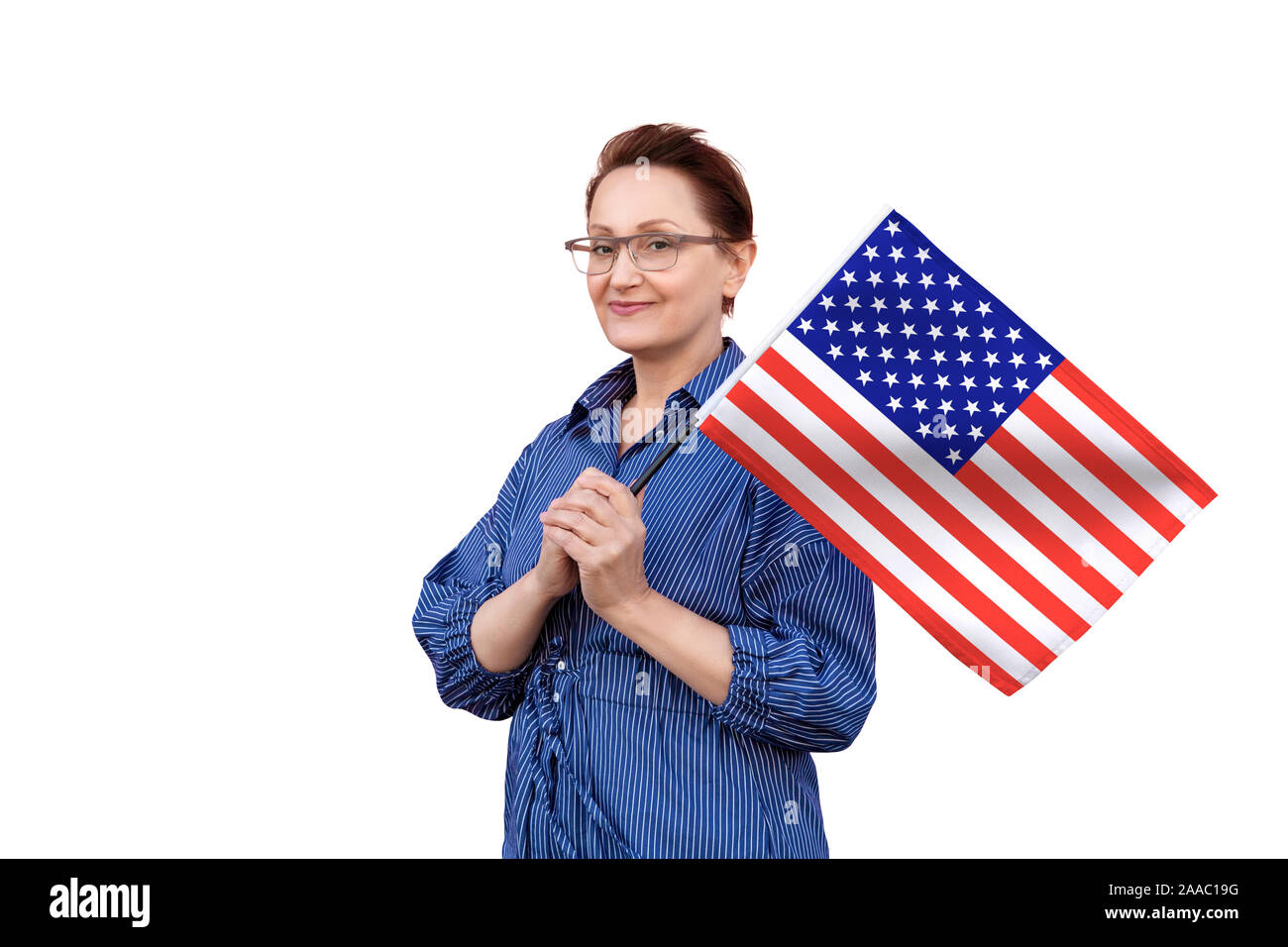 USA flag. Woman holding American flag. Nice portrait of middle aged ...