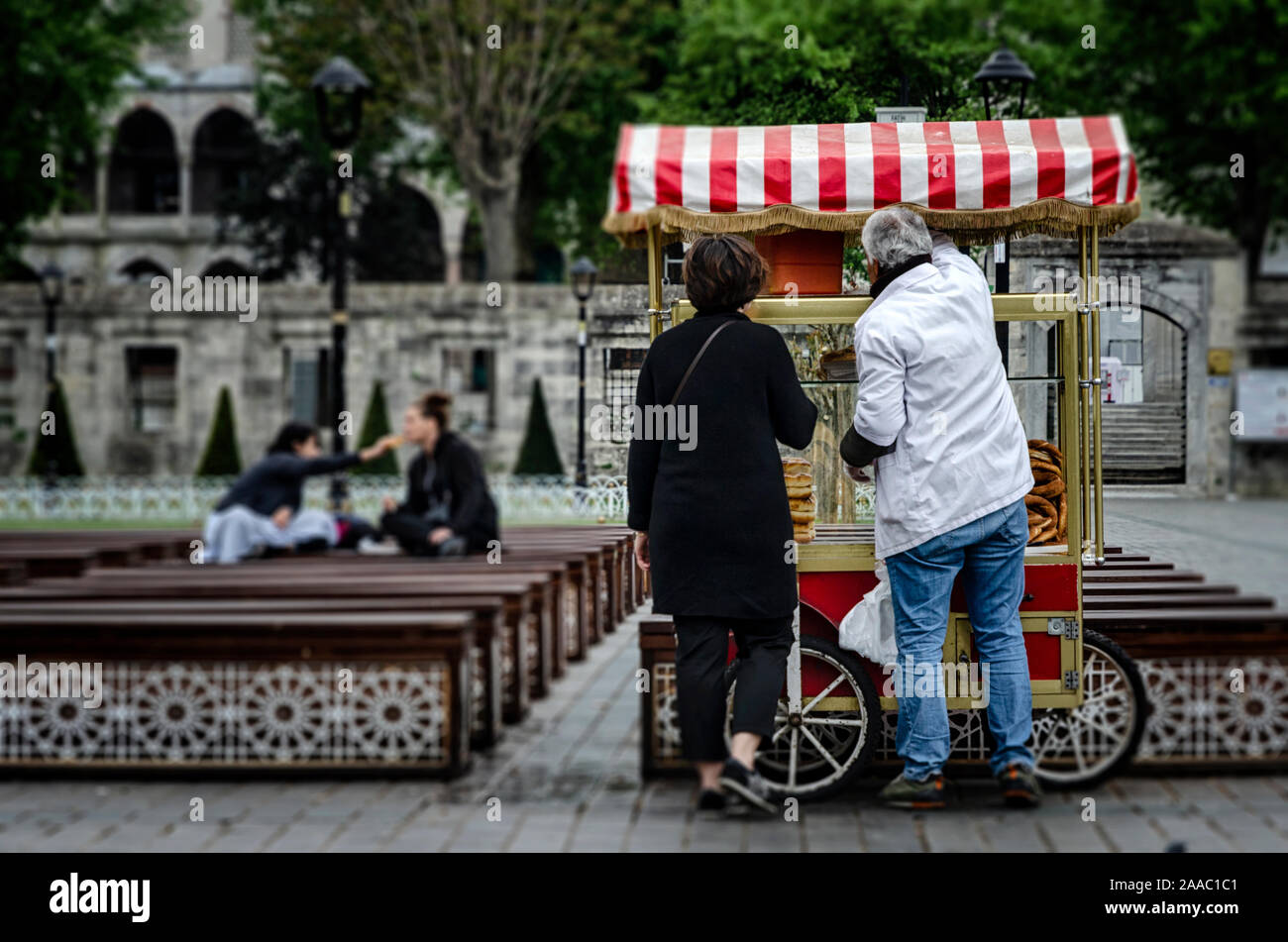 Street seller of fast food with bagle and simit on traditional turkish ...