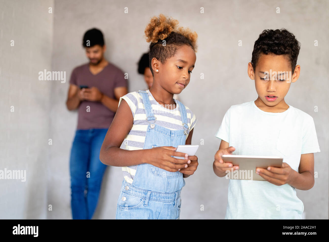 Modern children using mobile devices, tablet, smartphone. Technology ...