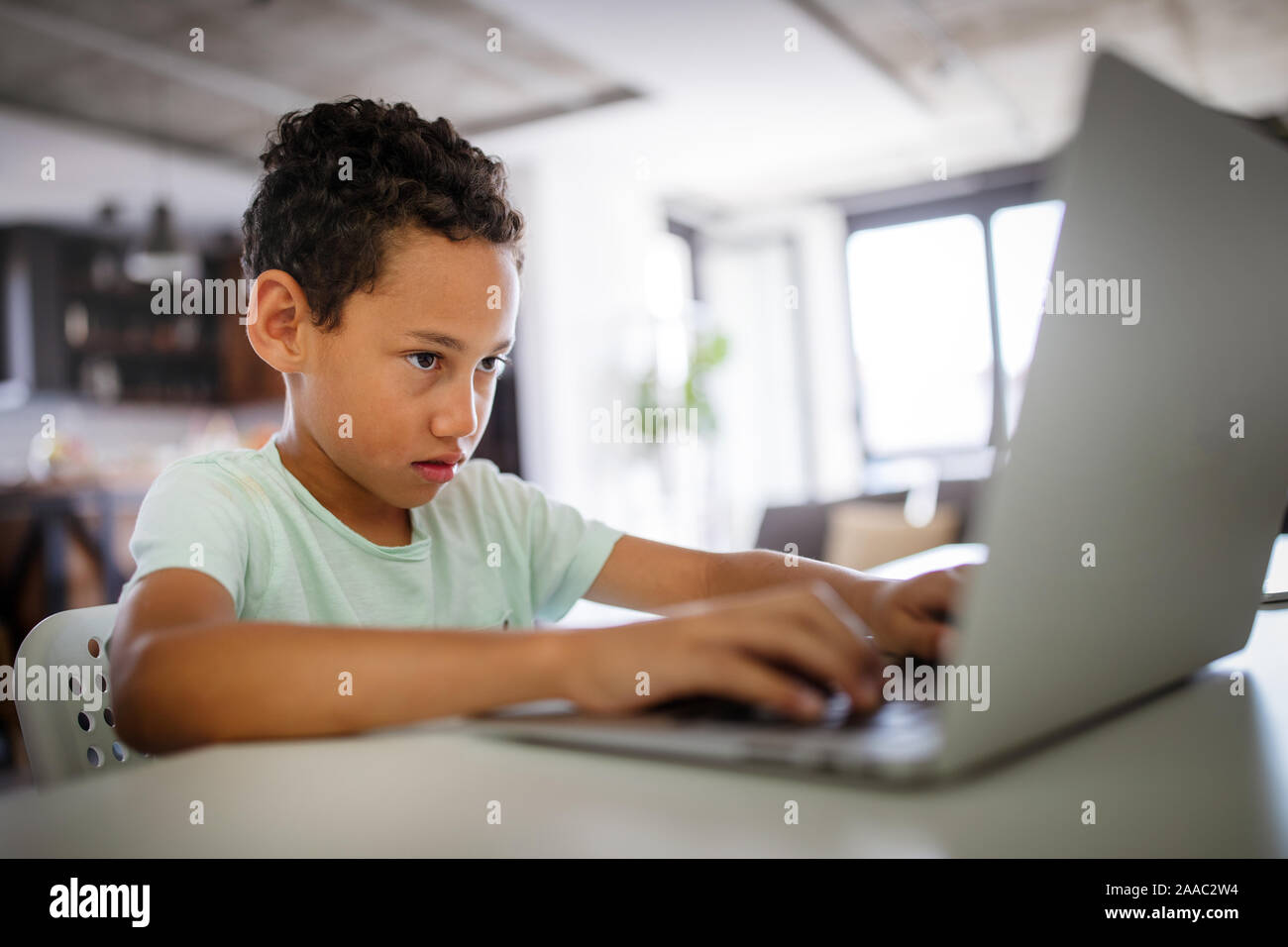African american school boy technology hi-res stock photography and ...