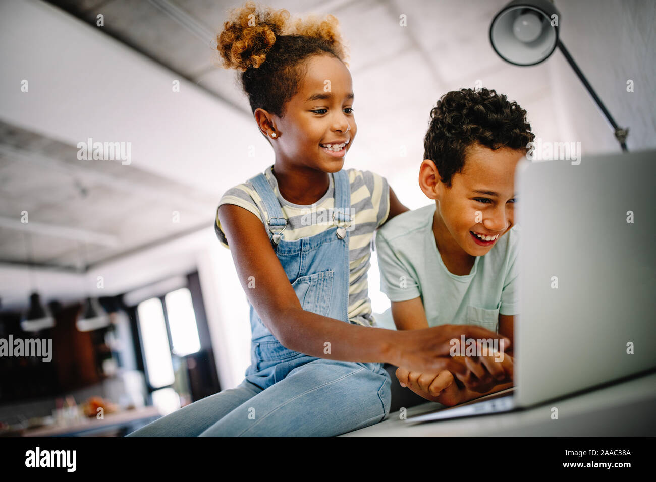 Kids, technology concept. Happy children using laptop to learn, play ...