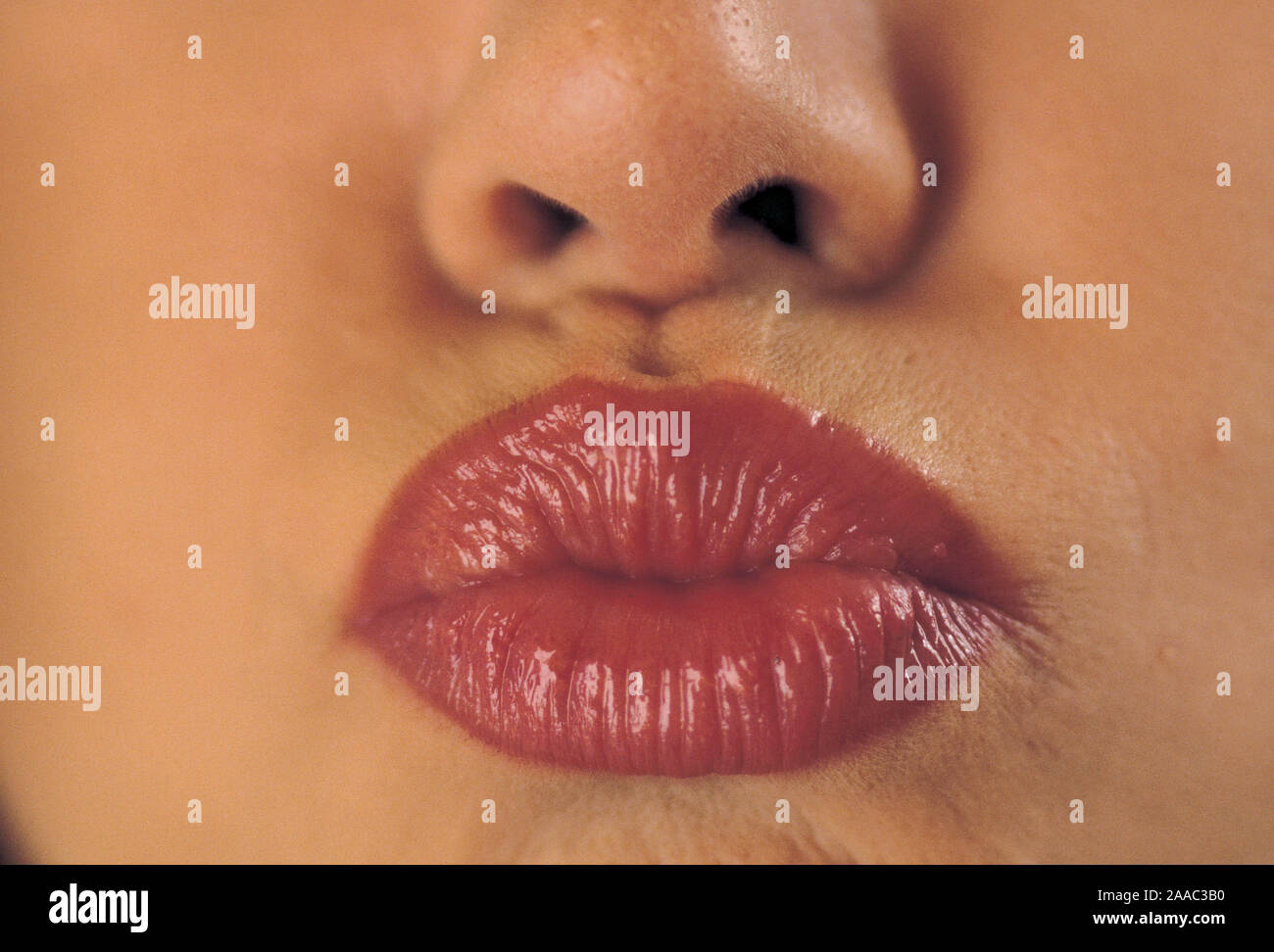 Woman kissing lips pulling hi-res stock photography and images - Alamy