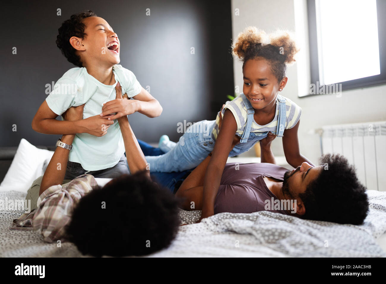 Happy black family having fun times at home Stock Photo - Alamy