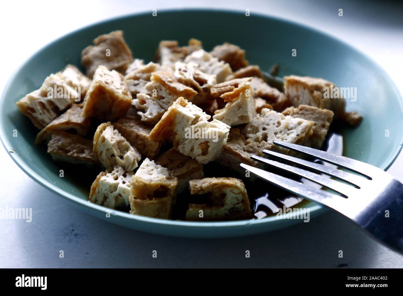 Photo of freshly cooked sliced fried tokwa or tofu served as side dish ...