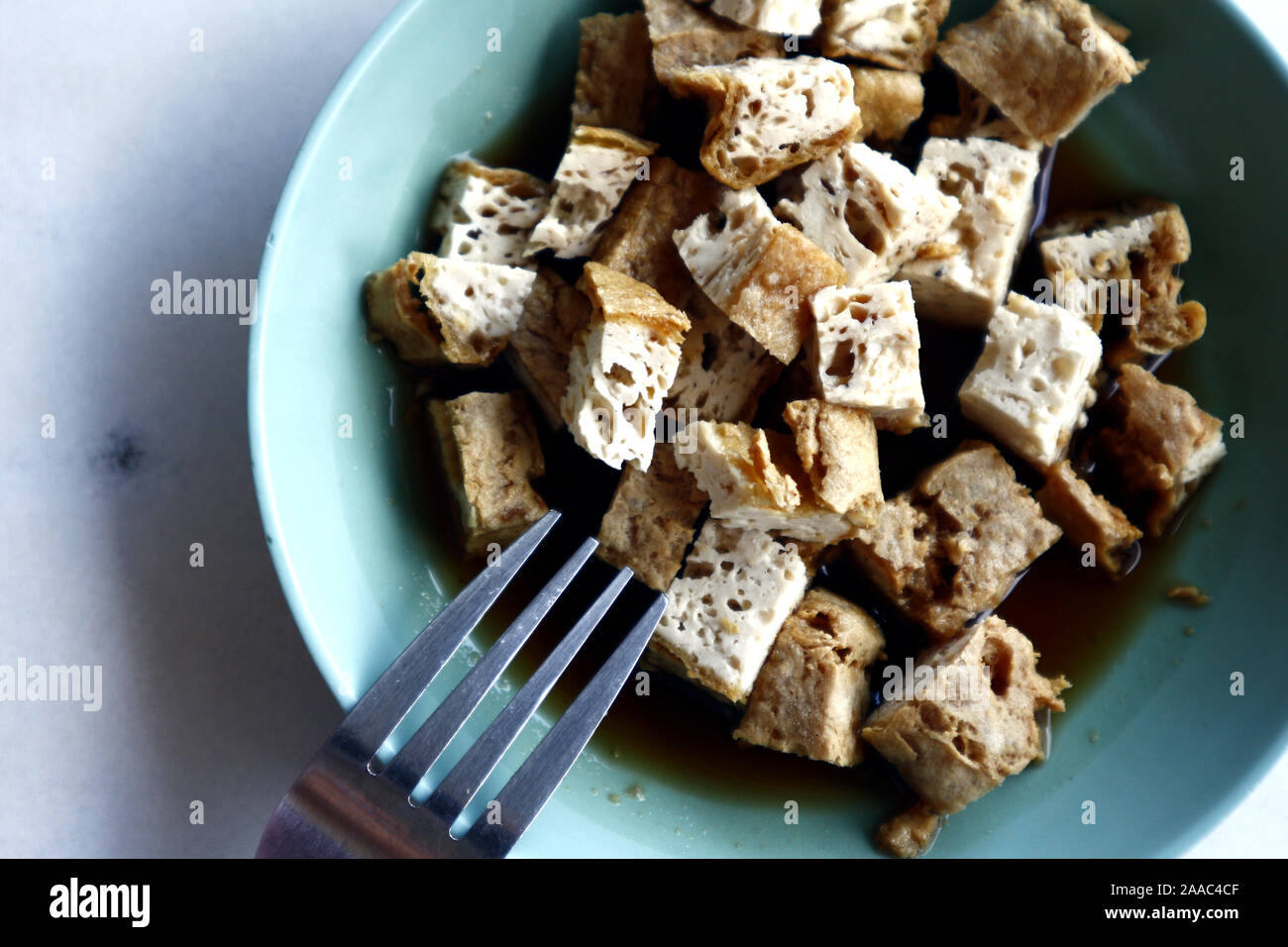 Photo of freshly cooked sliced fried tokwa or tofu served as side dish ...