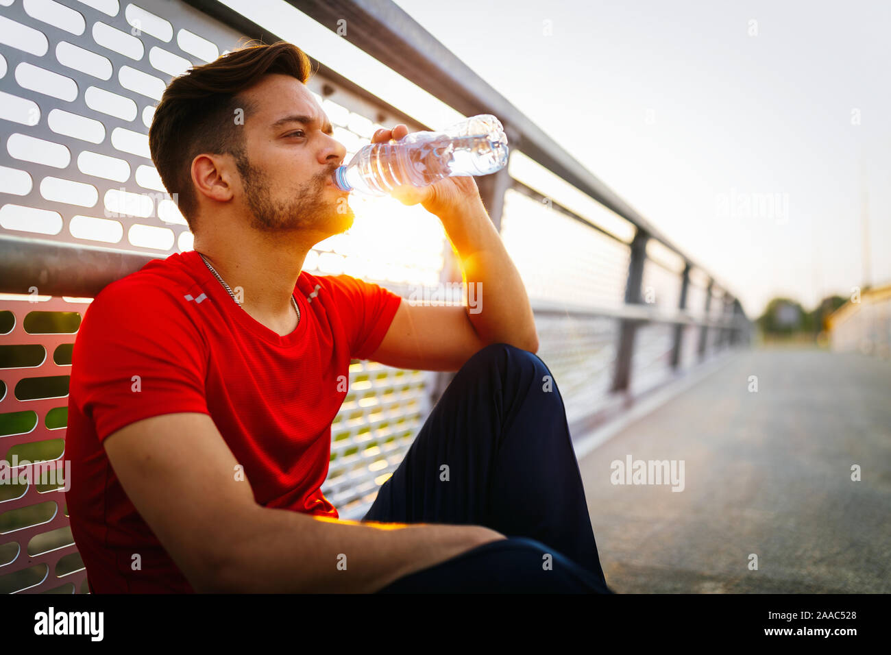 Running male adult taking a break. Tired exhausted man runner sweating ...