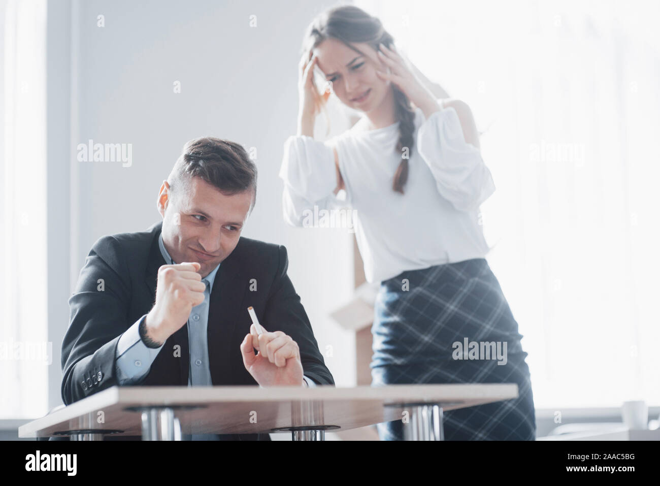 An angry harsh dissatisfied boss who teaches an incompetent employee, a ...