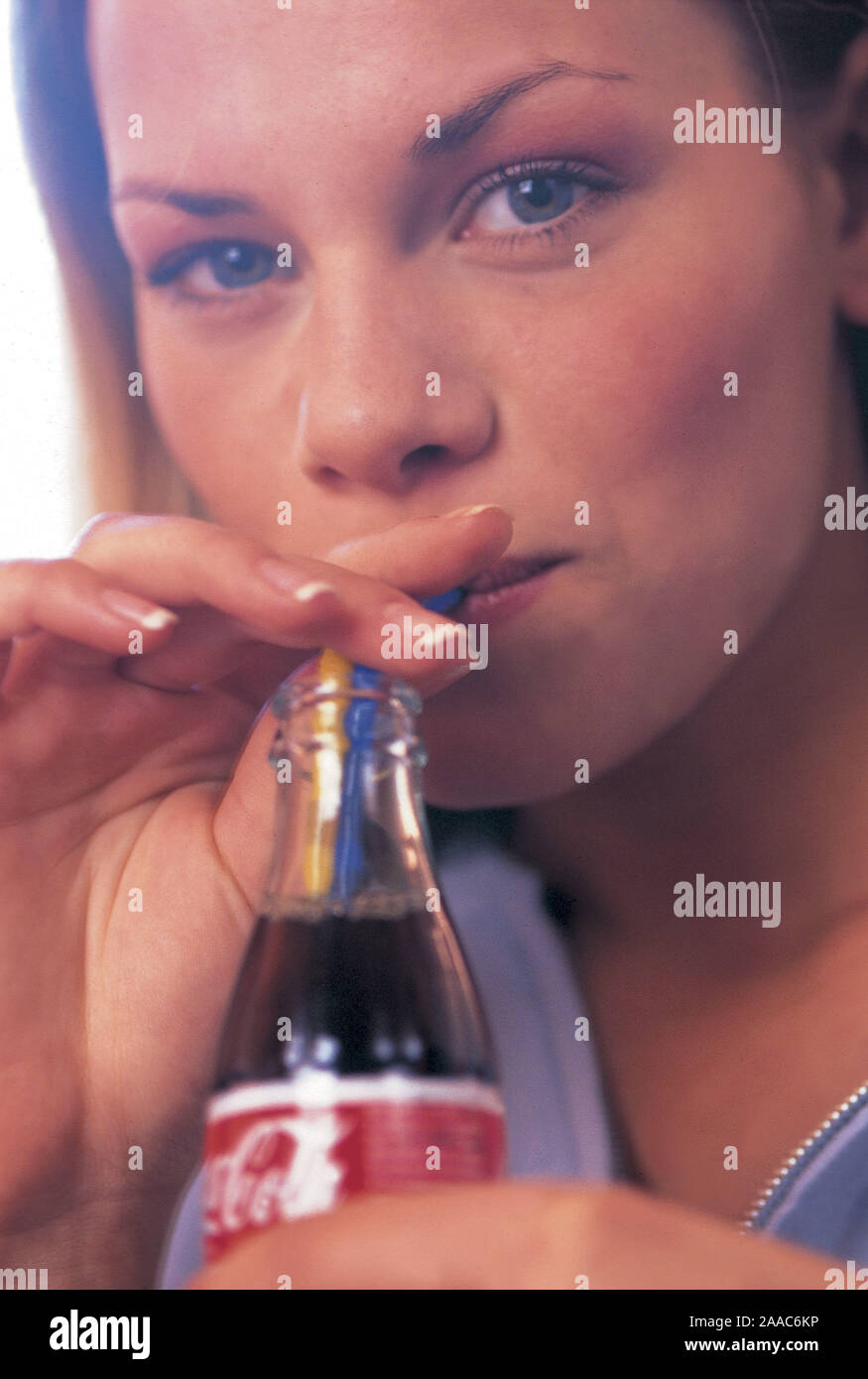 Woman and coke bottle hi-res stock photography and images - Alamy